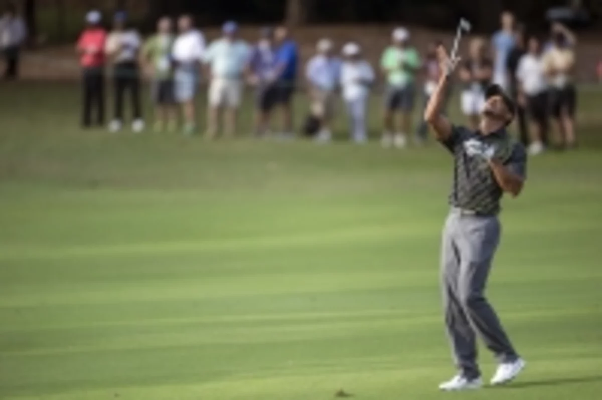 Tiger returns with five-over round - Golf Clothing Journal